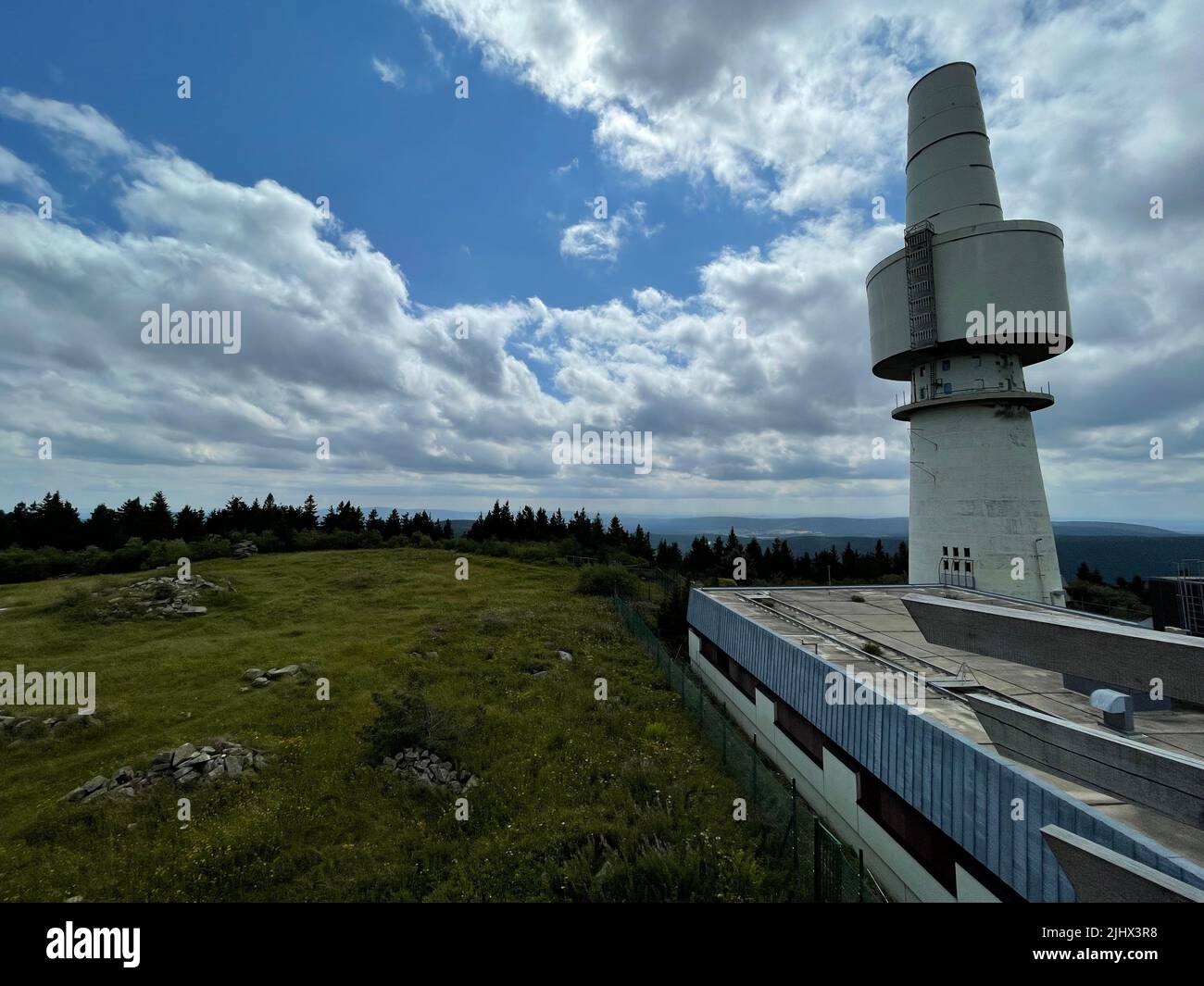 A beautiful view of a white observation tower near a forest Stock Photo ...