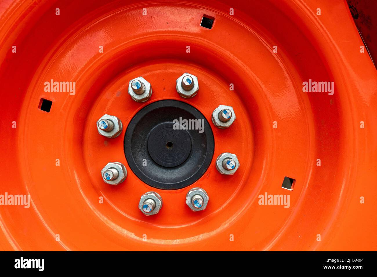 Detail of bolts on the rim of a tractor wheel Stock Photo - Alamy