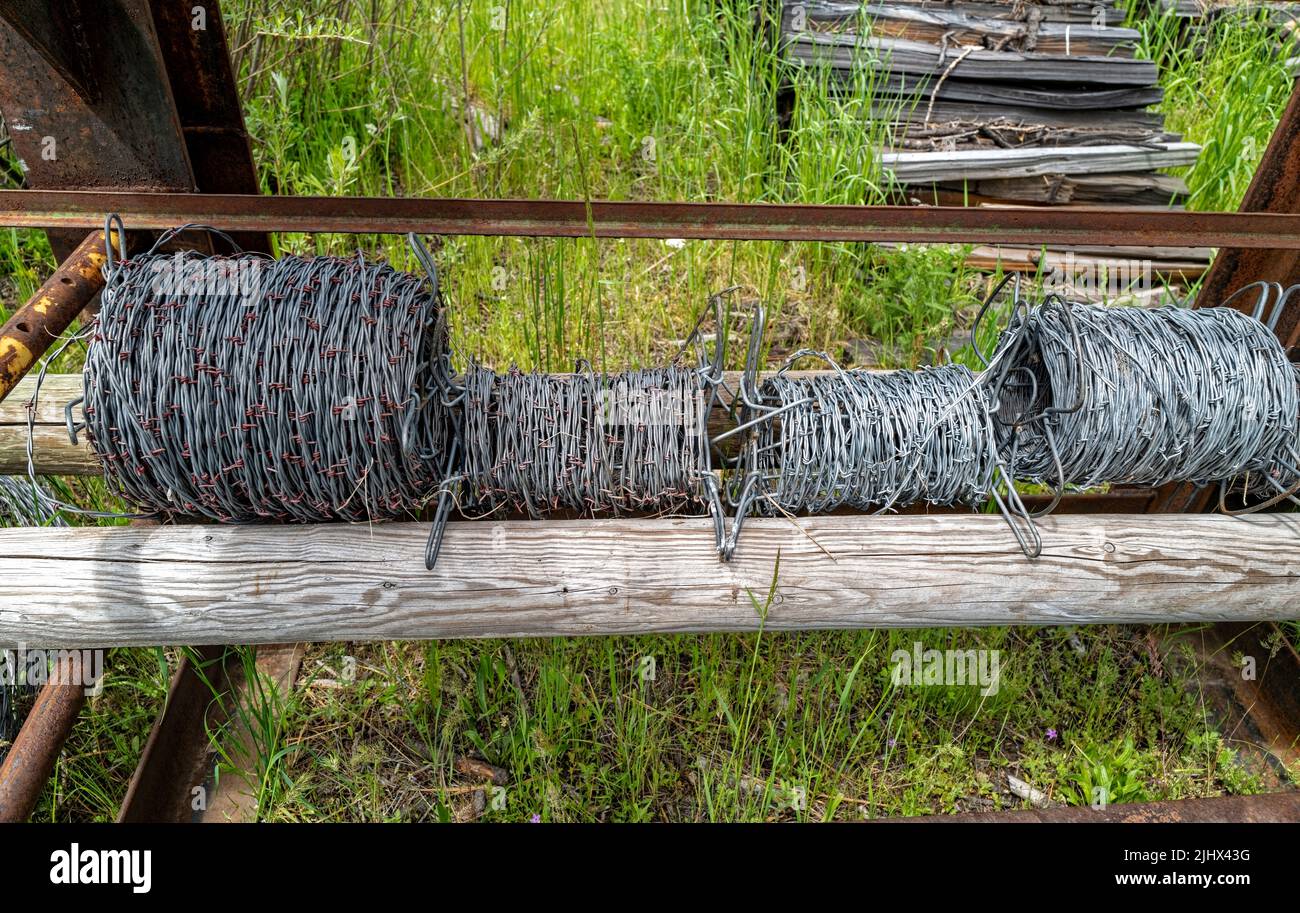 Spools of barbed wire stored on a farm in central Oregon, USA Stock ...
