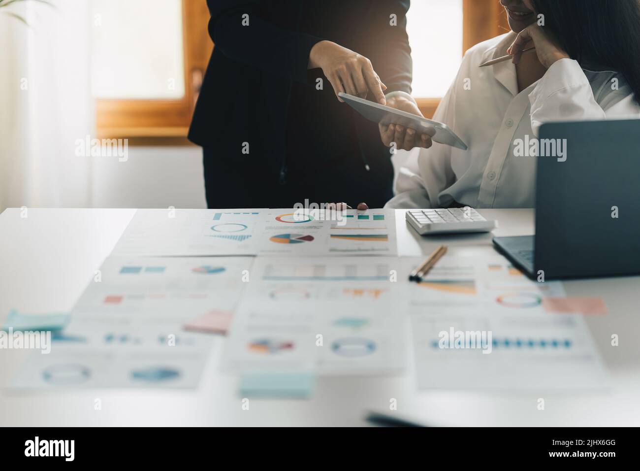 Analytics intelligence concept. Group of business people discuss ...