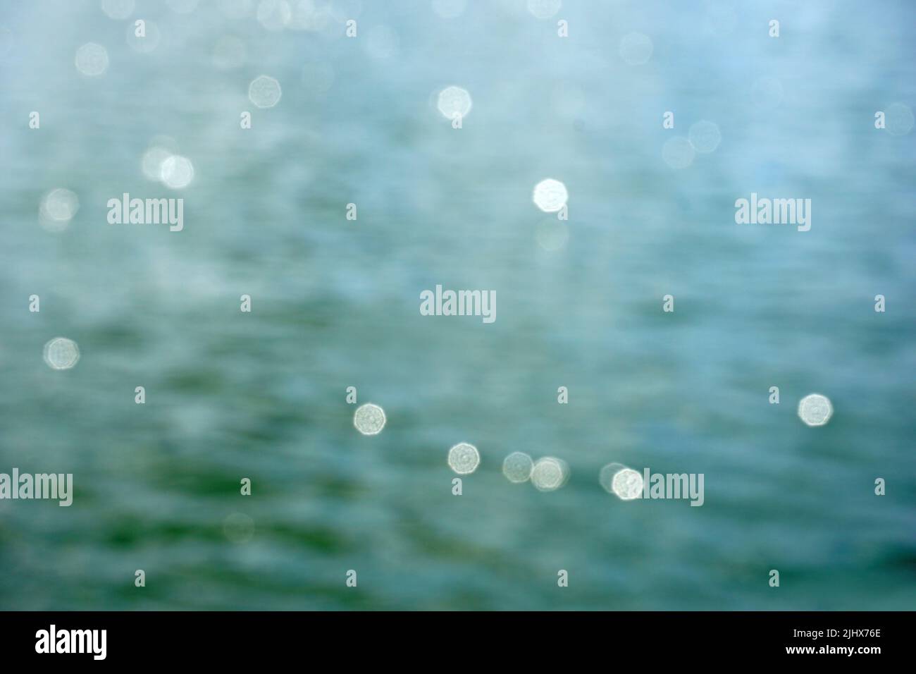 Sun reflecting in water surface - bokeh effect Stock Photo - Alamy