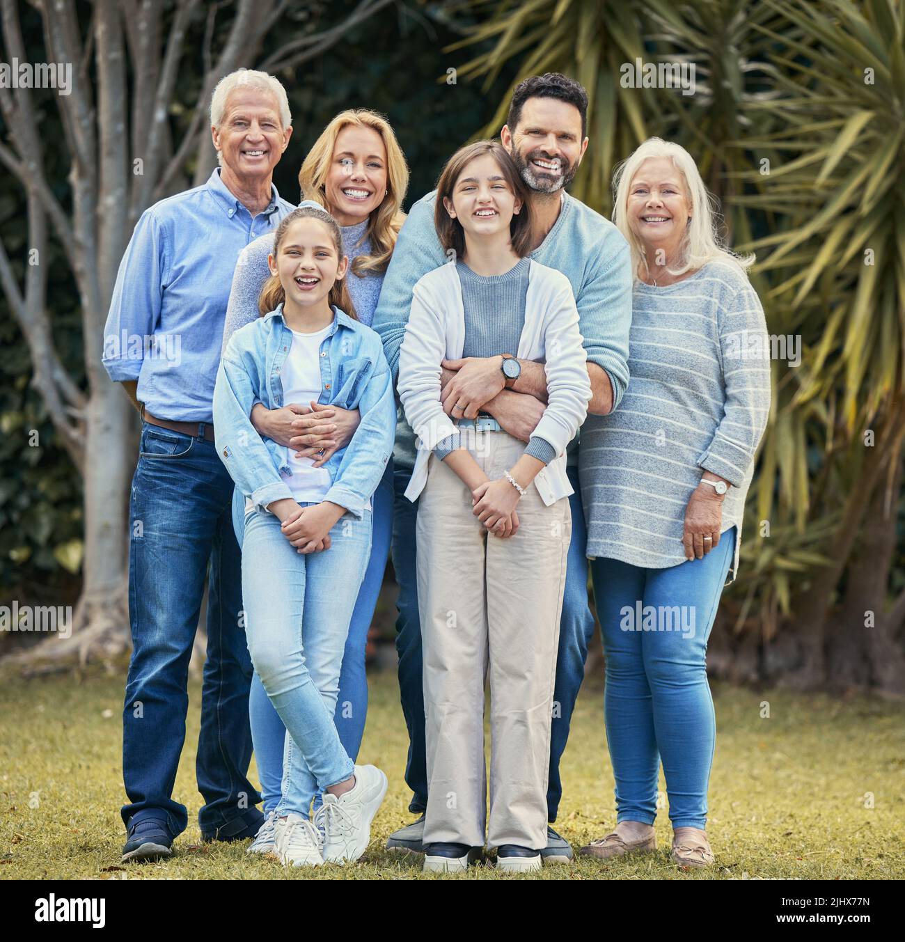 Family love is never broken. a multi-generational family standing ...