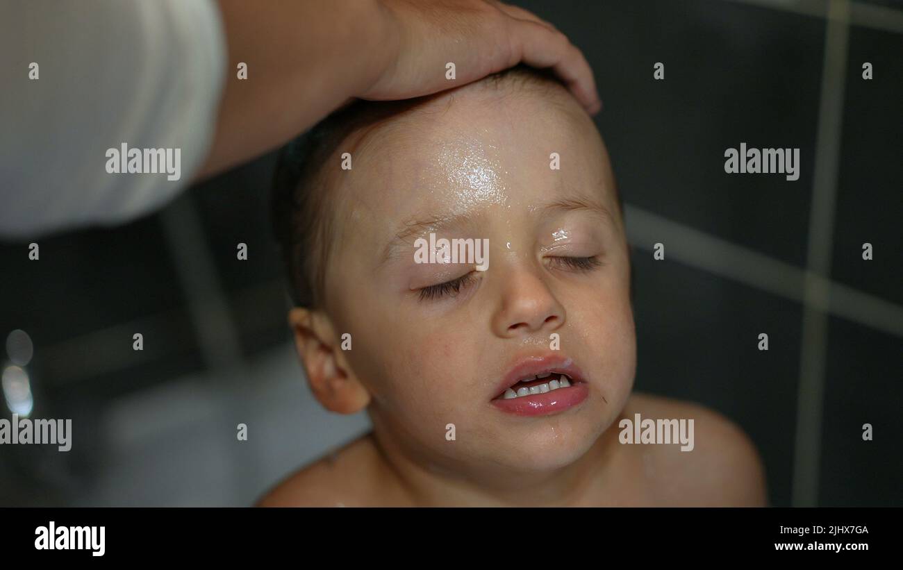 Bathing child hair inside bathtub Stock Photo - Alamy