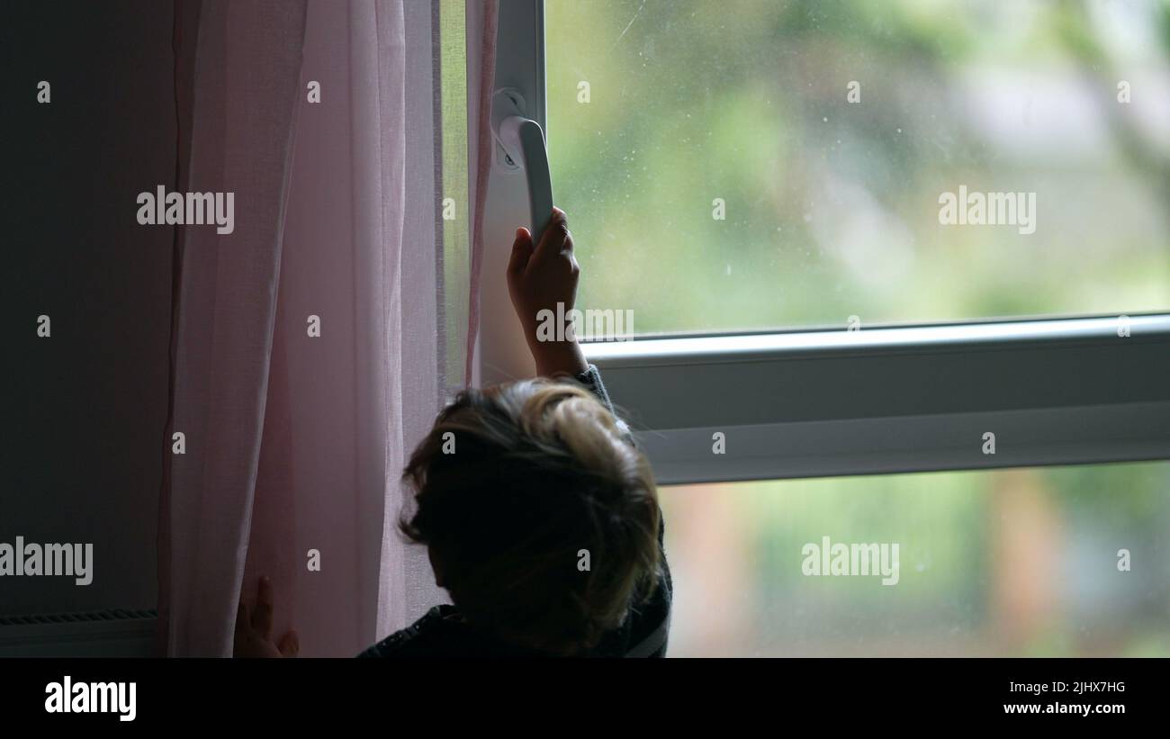 Little boy opening home window letting fresh air enter Stock Photo - Alamy