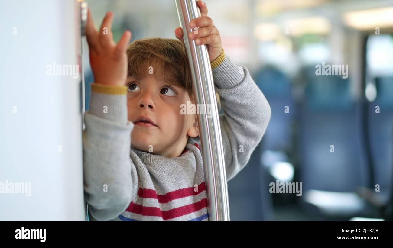Little boy riding bus. Child inside tram transportation Stock Photo - Alamy