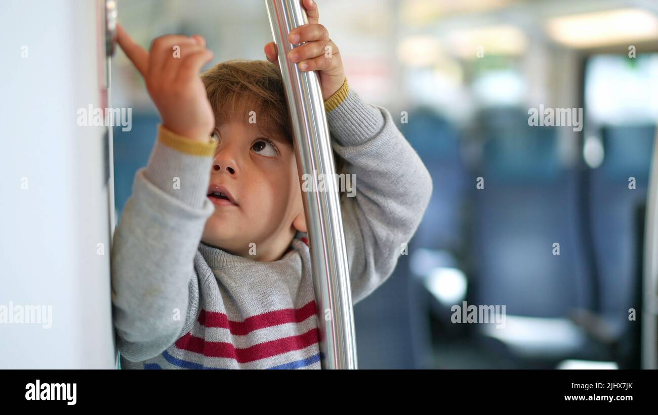 Little boy riding bus. Child inside tram transportation Stock Photo - Alamy