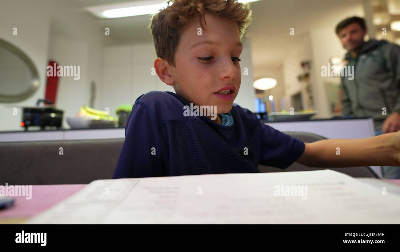 Child asking father for help with homework. dad giving advice for exam ...