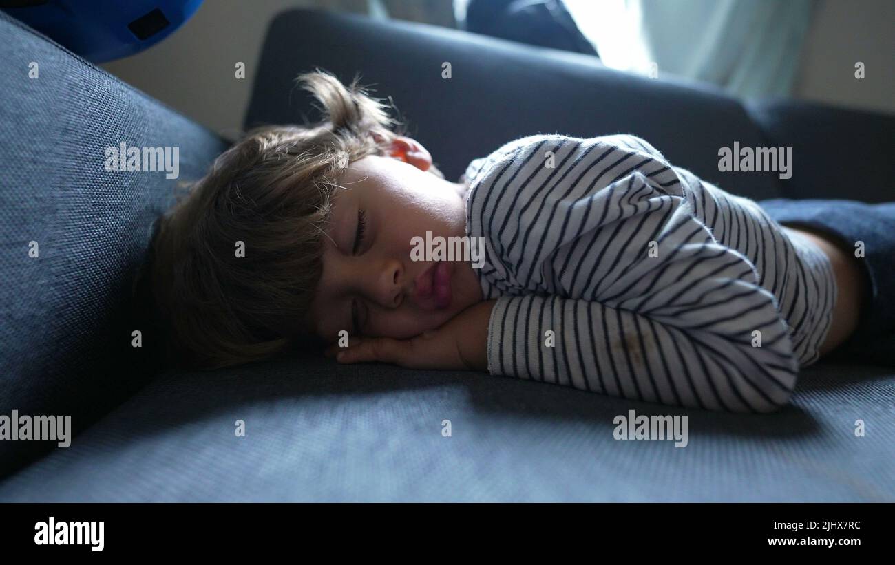 Child sleeping deeply during afternoon nap Stock Photo - Alamy