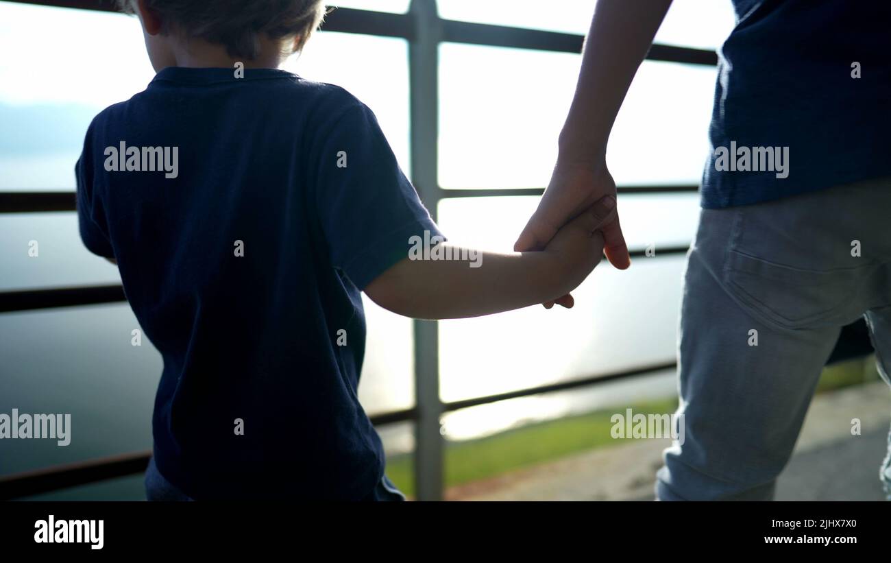 Tow children holding hands, brother holding little sibling hand Stock ...
