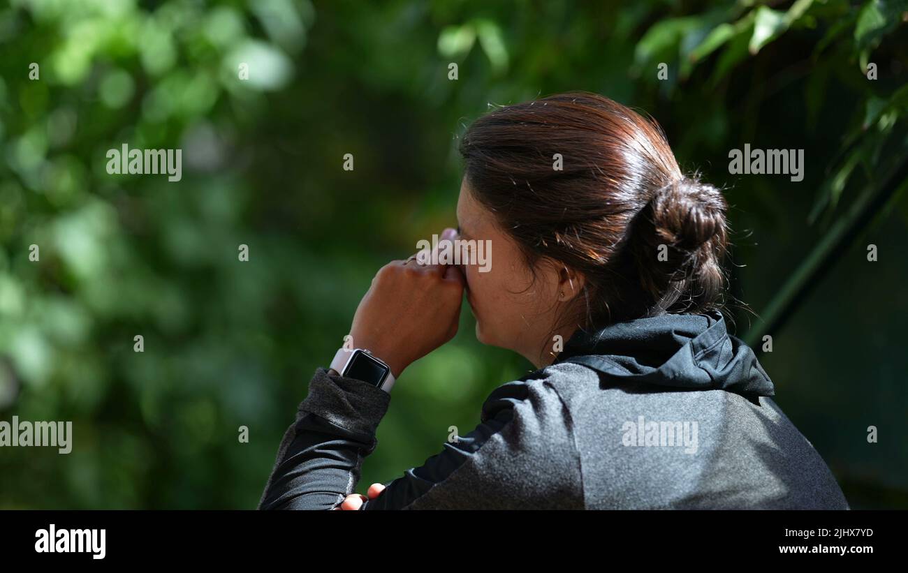 Woman rubbing nose. girl scratching face with hand Stock Photo - Alamy