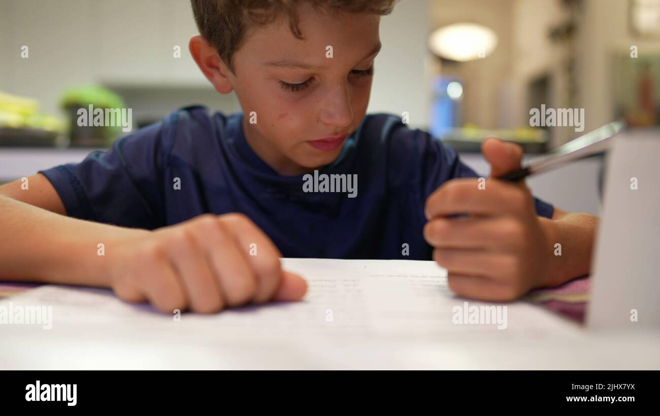 Young boy doing homework, concentrated kid preparing for exam Stock ...