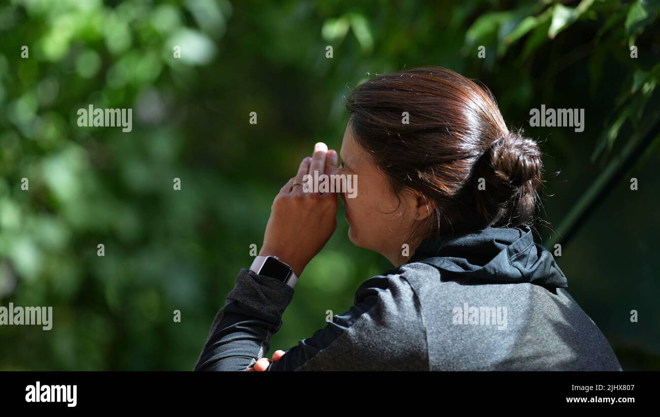 Woman rubbing nose. girl scratching face with hand Stock Photo - Alamy