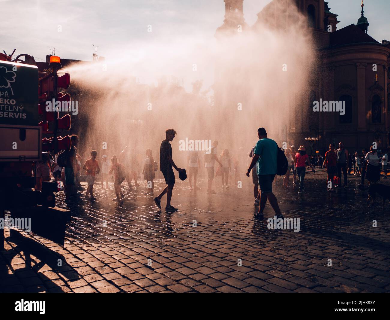 People walking through water to cool down Stock Photo - Alamy