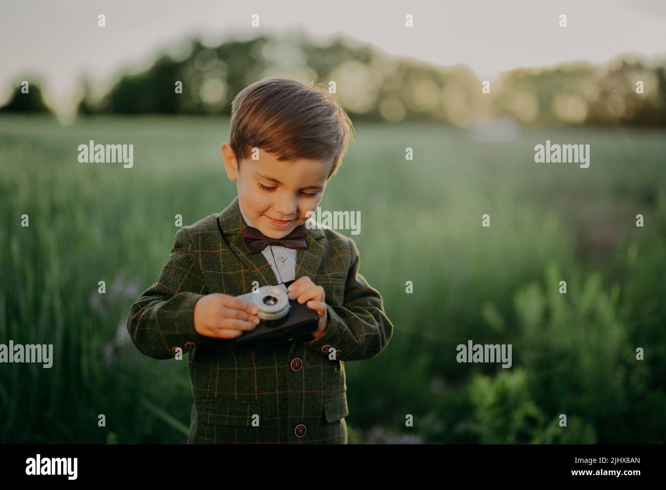 Handsome little boy with vintage retro camera. Kid as young ...