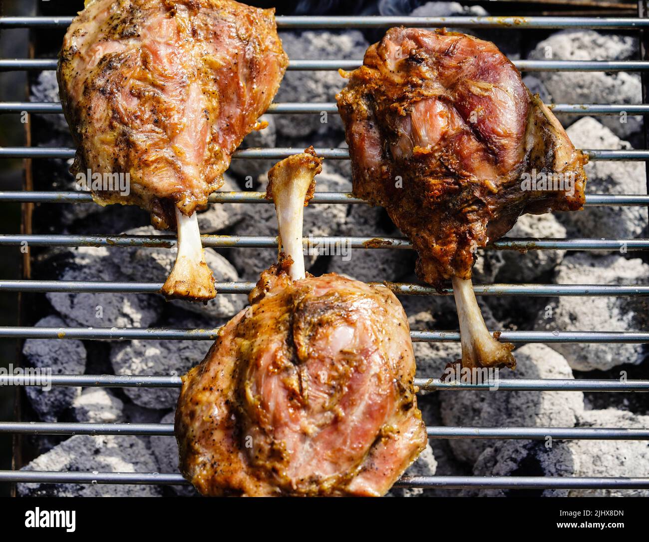 grilled pig wings - sliced open pork knuckle of a young pig Stock Photo ...