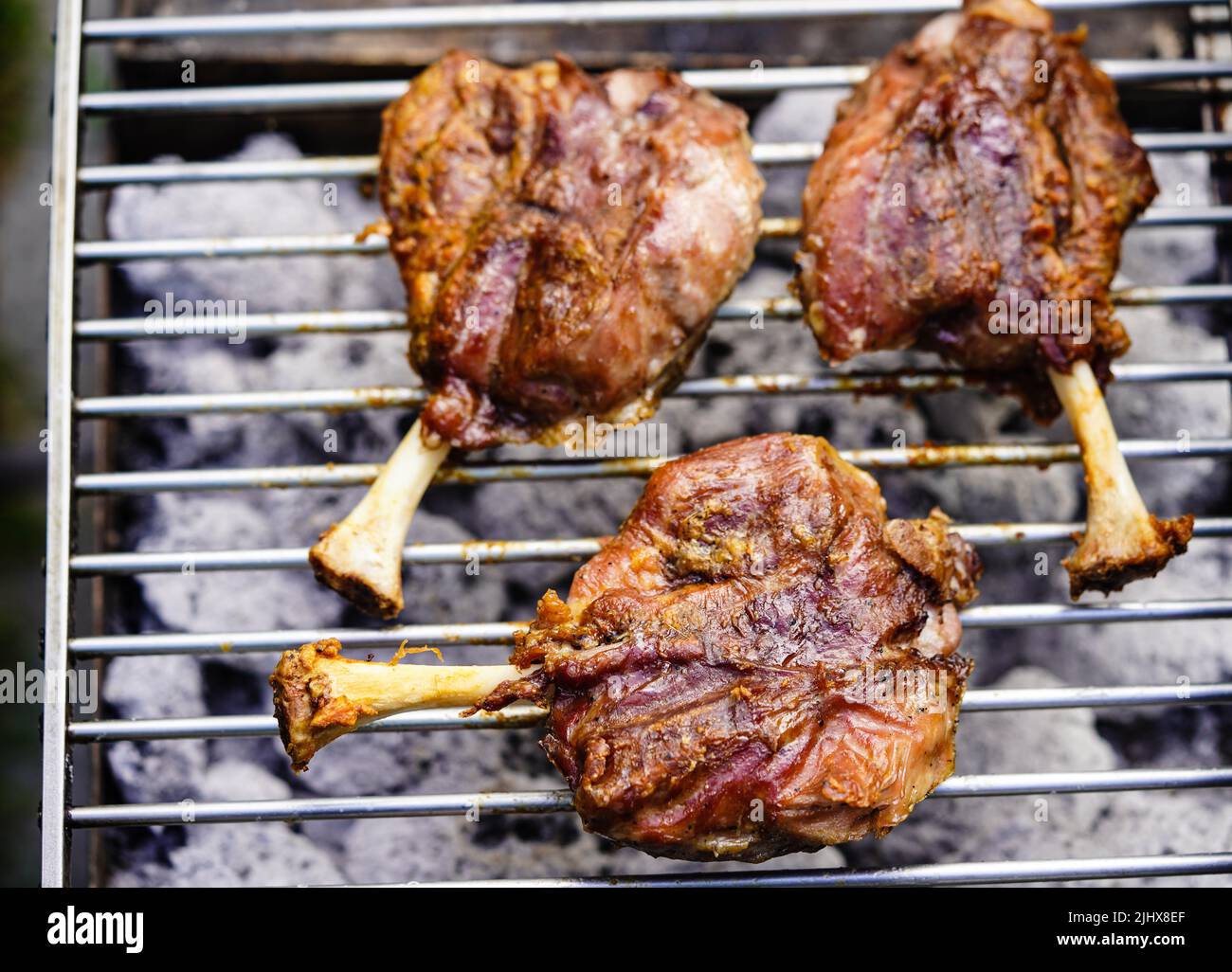 grilled pig wings - sliced open pork knuckle of a young pig Stock Photo ...