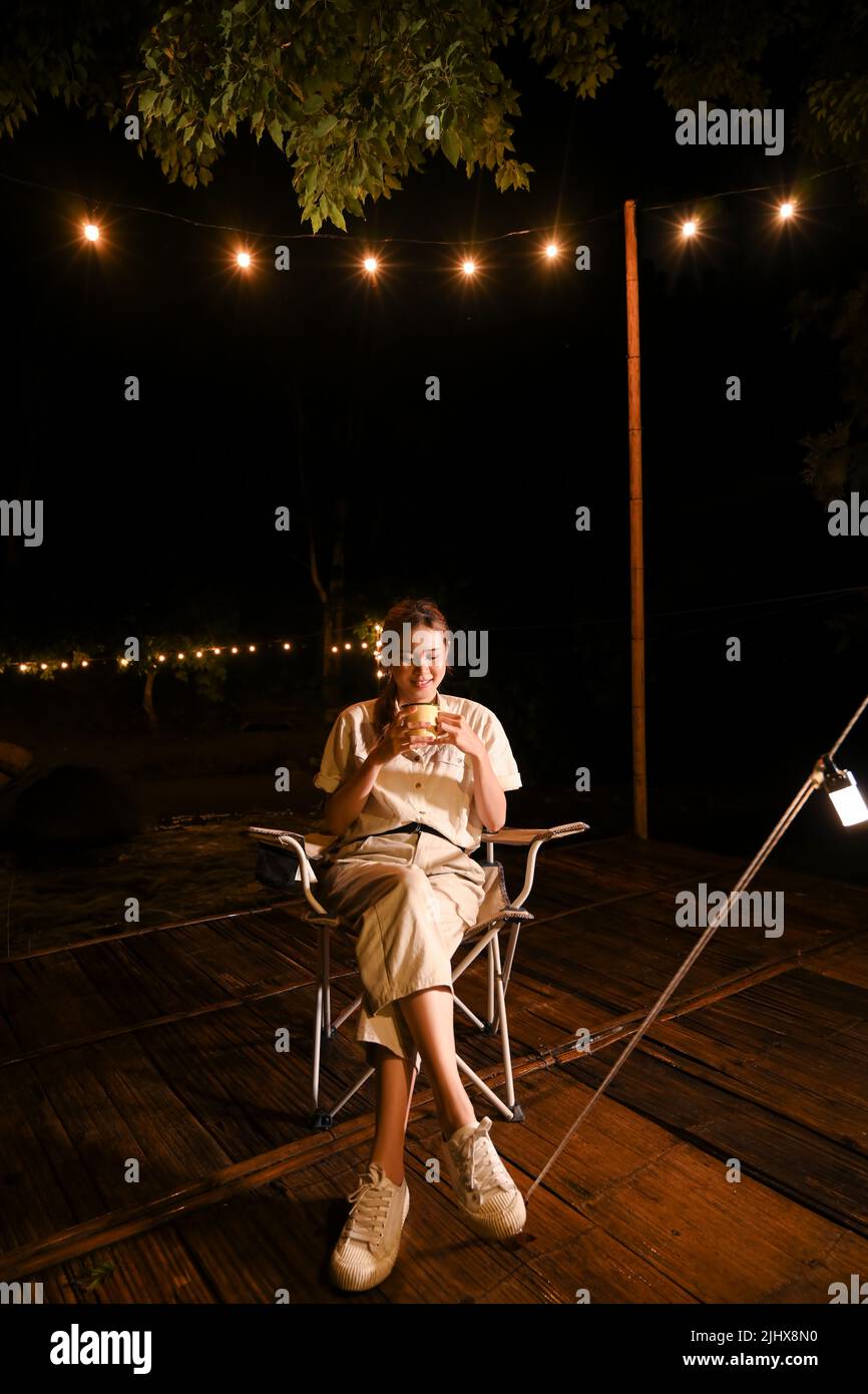 Woman chill in camp chair hi-res stock photography and images - Alamy