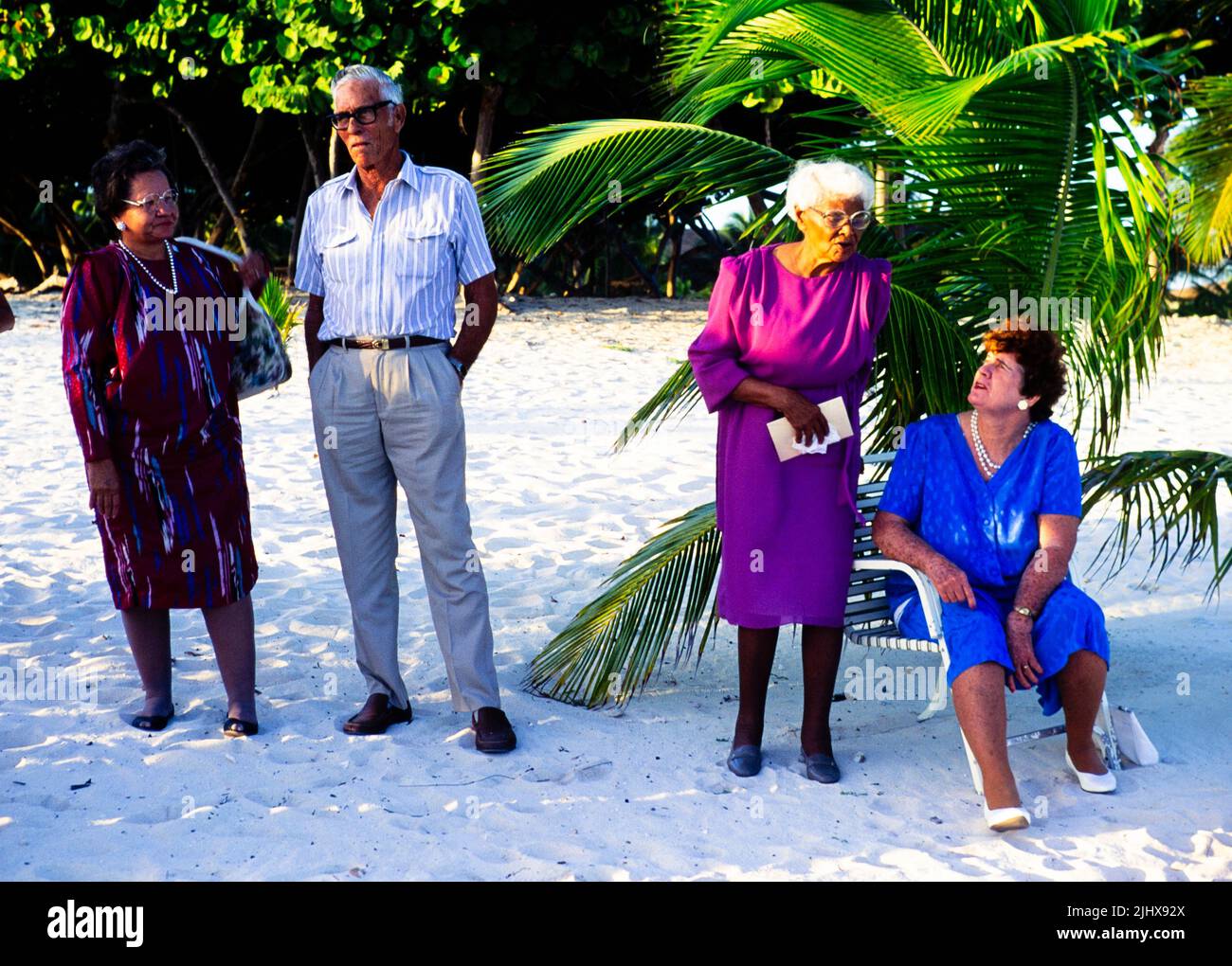 Guests at wedding ceremony on the beach at Brac Reef, Cayman Brac ...