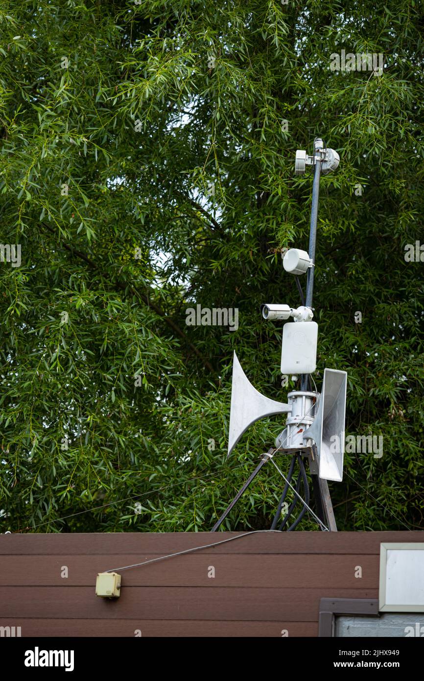 repeater with CCTV camera on the roof of the building. High quality ...