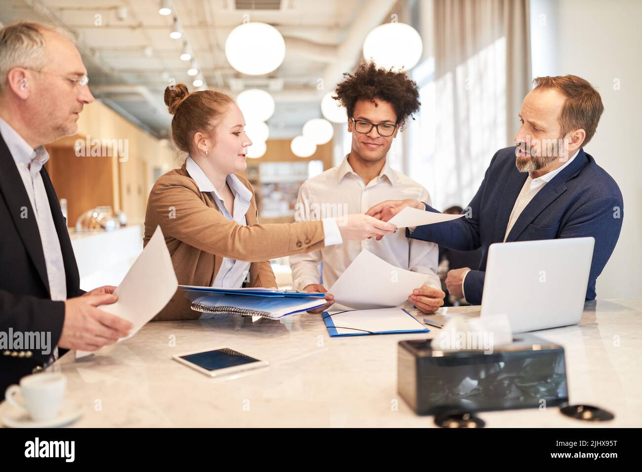 Startup founders and business consultants work together in the ...