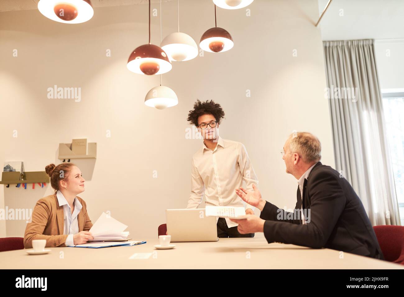 Design team meeting in conference room hi-res stock photography and ...