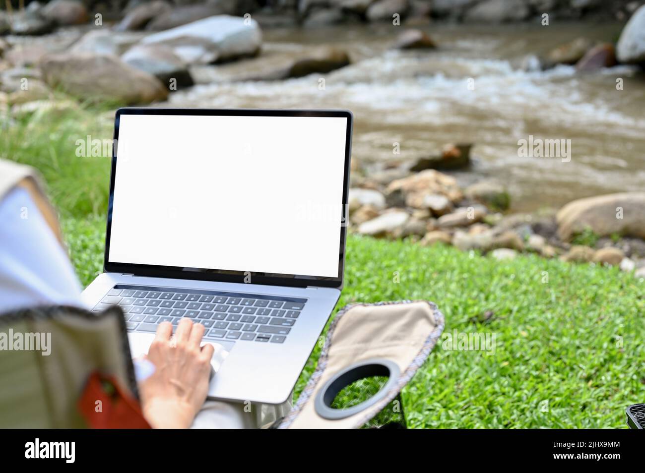 Close-up image, Female using notebook laptop computer while taking a ...