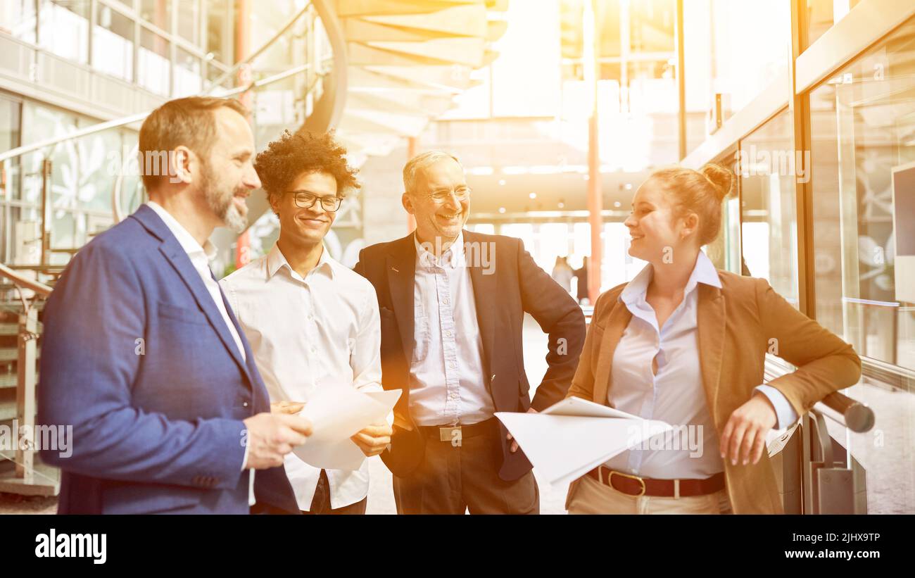 Successful business team together in light modern office building Stock ...