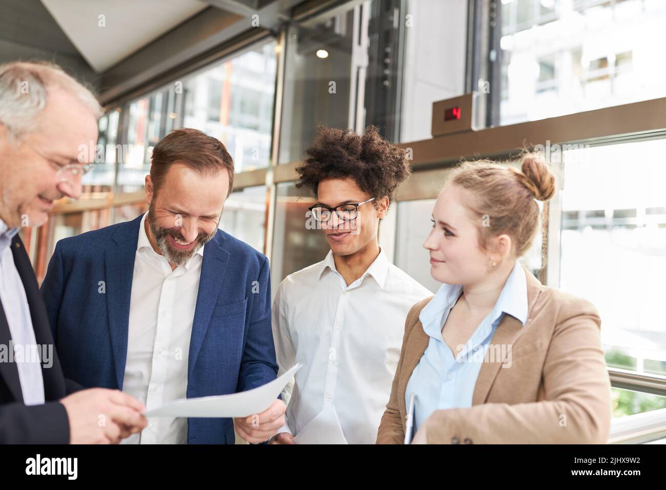 The startup team and consultants are happy together about a positive ...