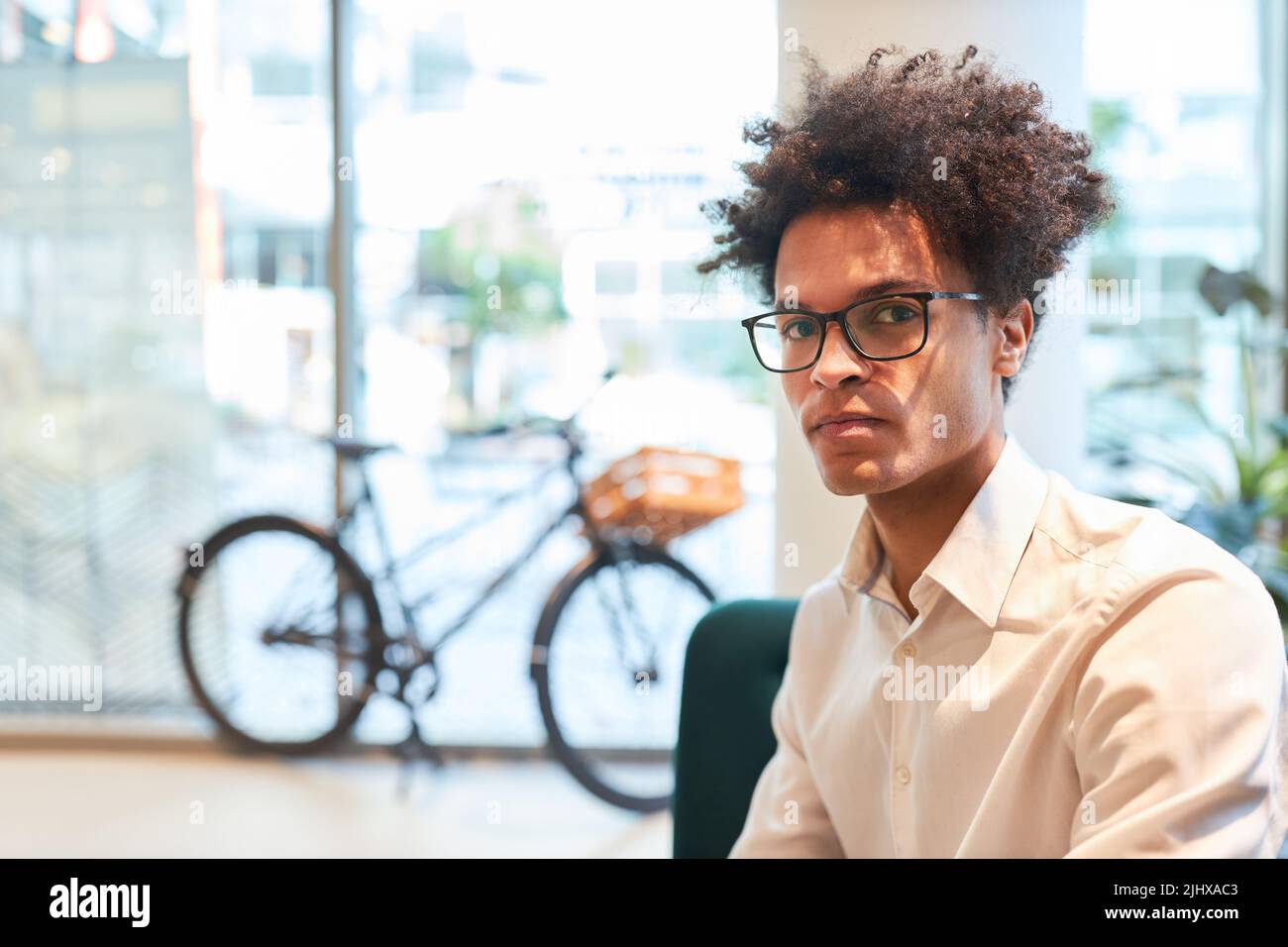 Young business man as a skeptical startup founder Stock Photo - Alamy