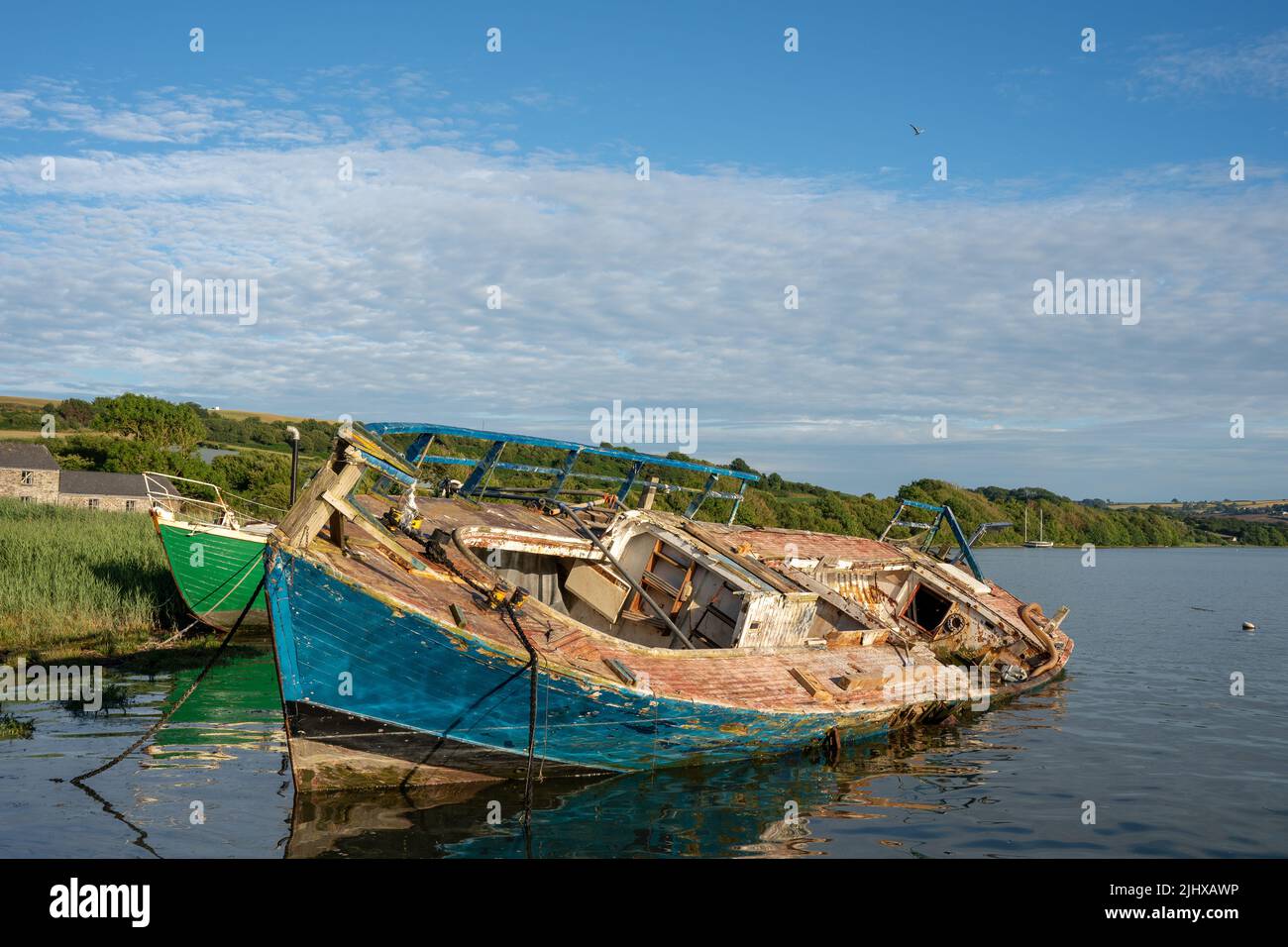 old derelict fishing boat being broken down in breakers yard wales UK Stock Photo - Alamy