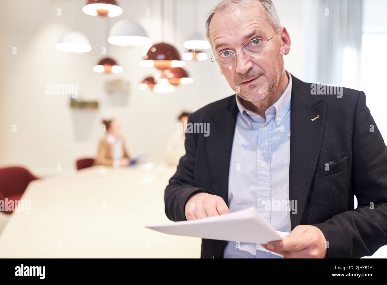 Older businessman as manager or senior boss with experience and ...