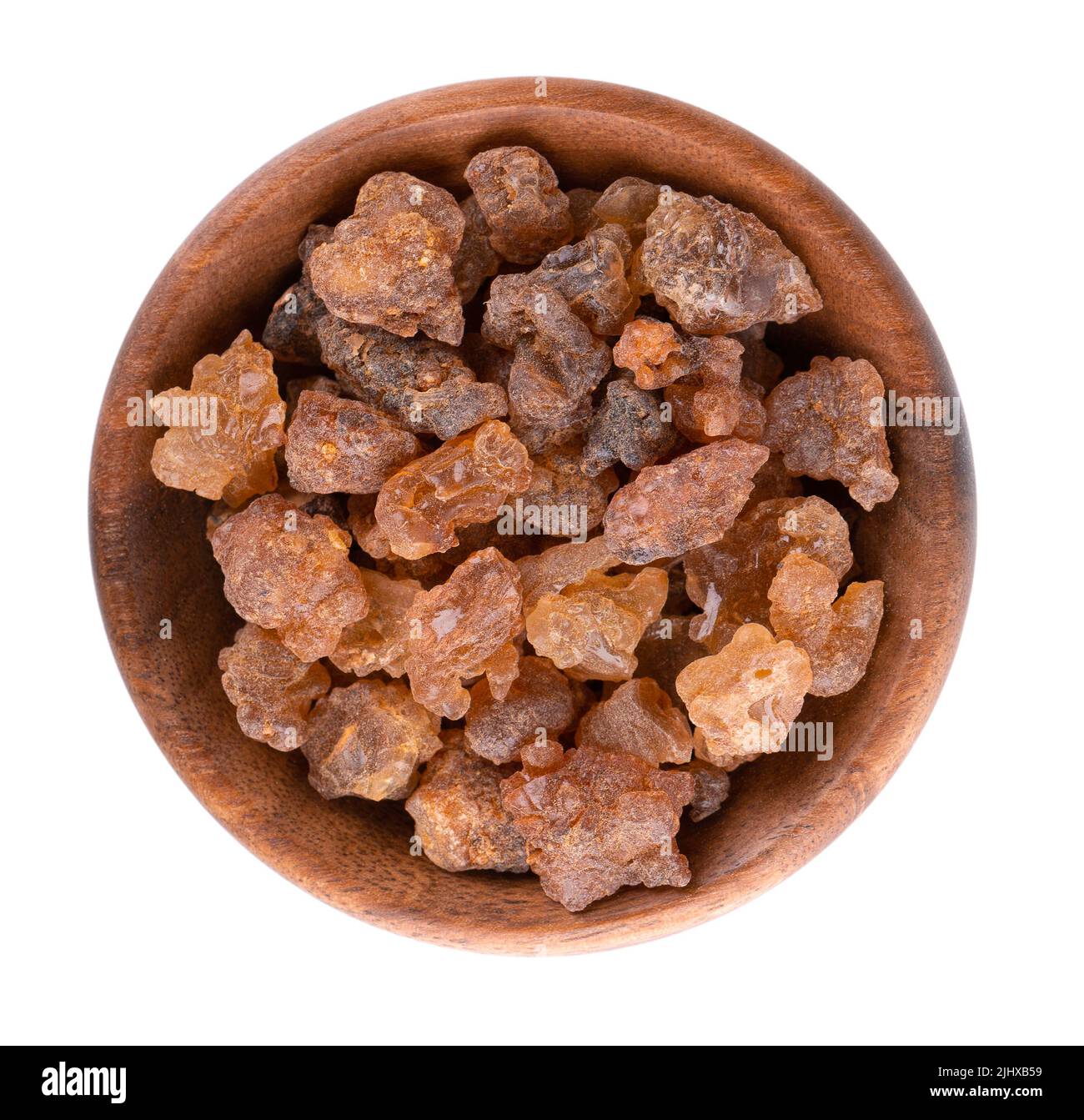 Myrrh resin in wooden bowl, isolated on white background. Pile of ...
