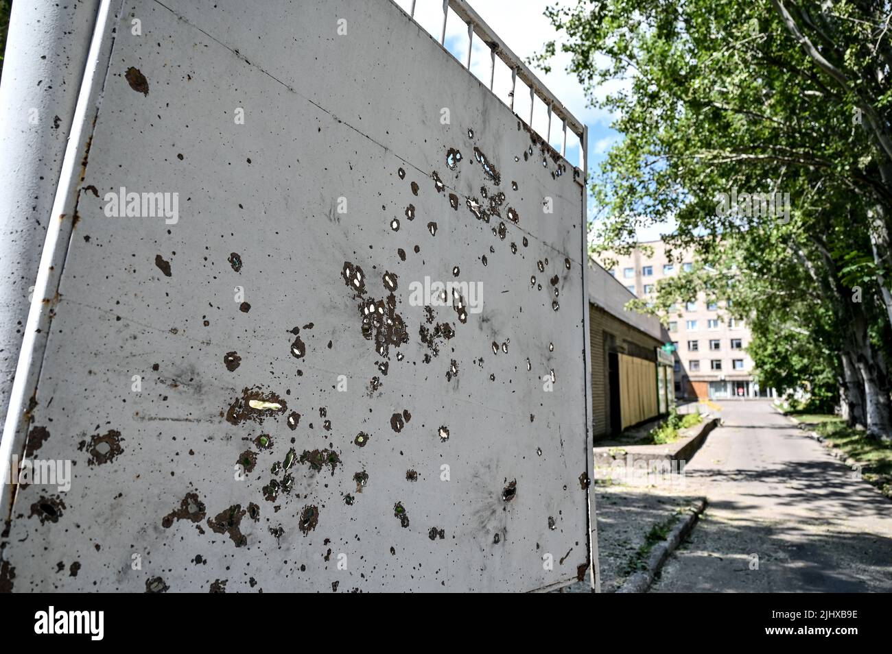 NIKOPOL, UKRAINE - JULY 20, 2022 - Shrapnel holes dot a gate in Nikopol ...