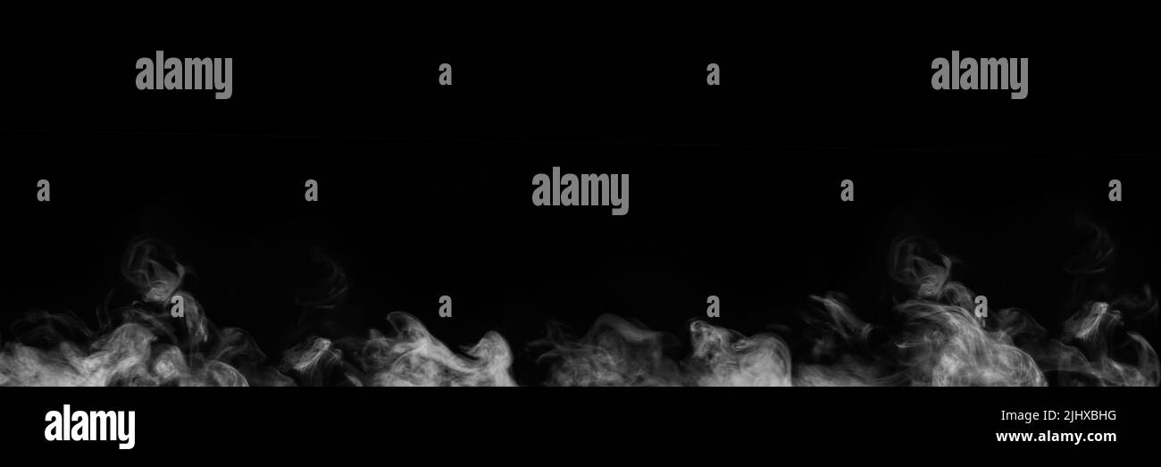 Panorama of steam, smoke, gas isolated on a black background. Swirling ...
