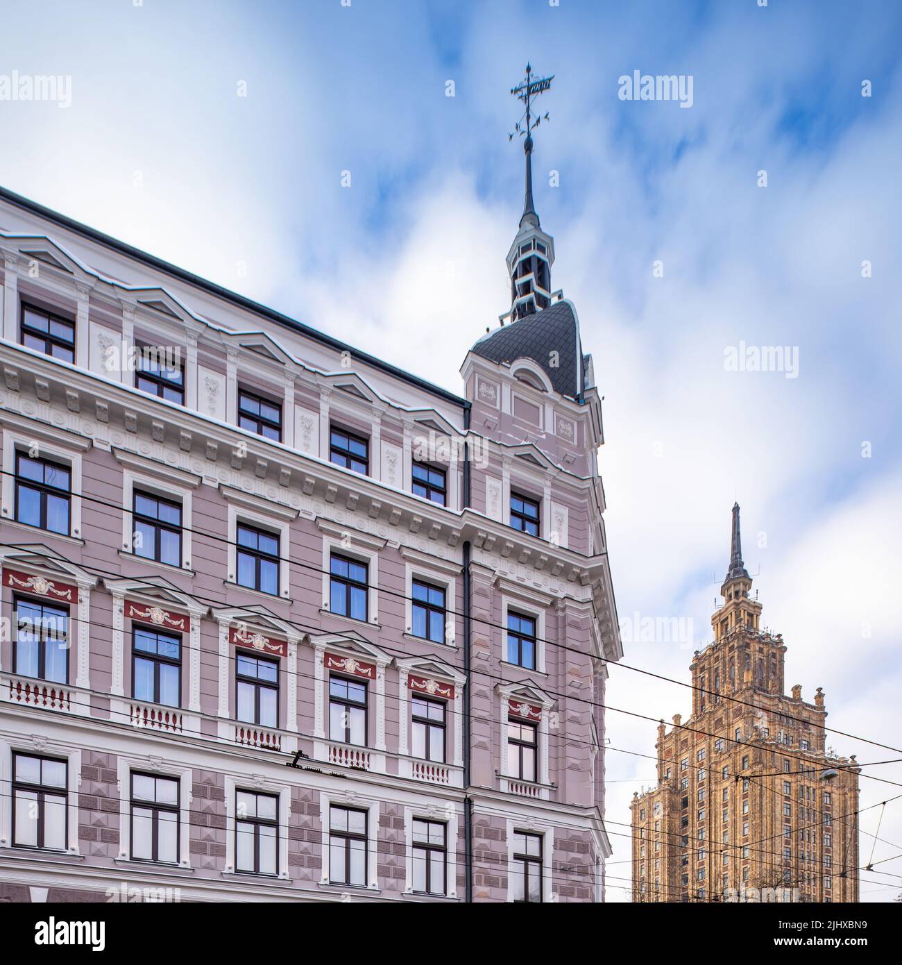 Winter cityscape of Riga. Modern architecture. Snow on road. Cloudy sky ...