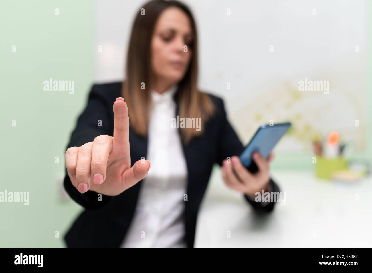 Businesswoman Holding Tablet With One Hand And Pointing Important Ideas ...