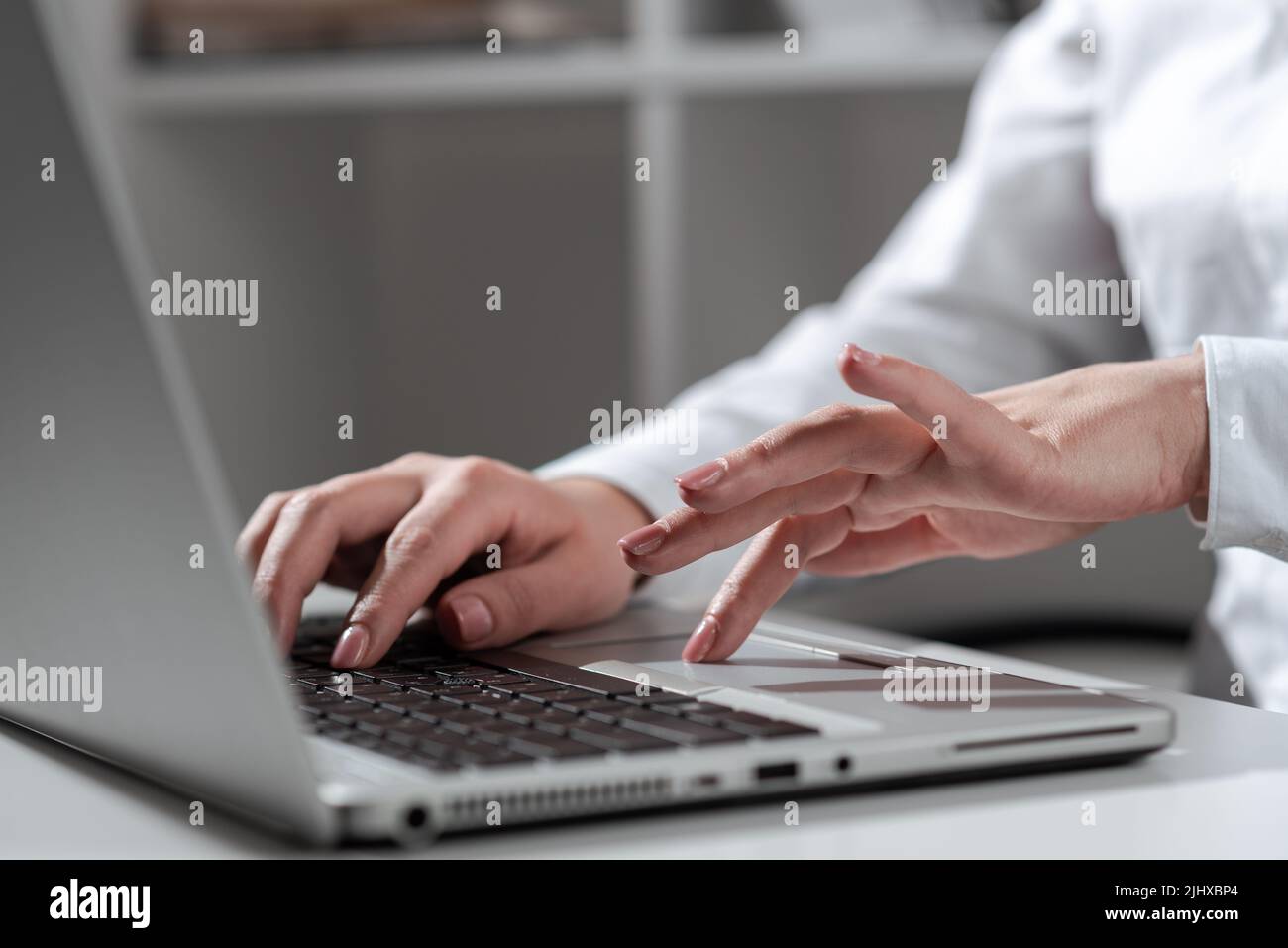 Businesswoman Typing Recent Updates On Lap Top Keyboard On Desk. Woman ...