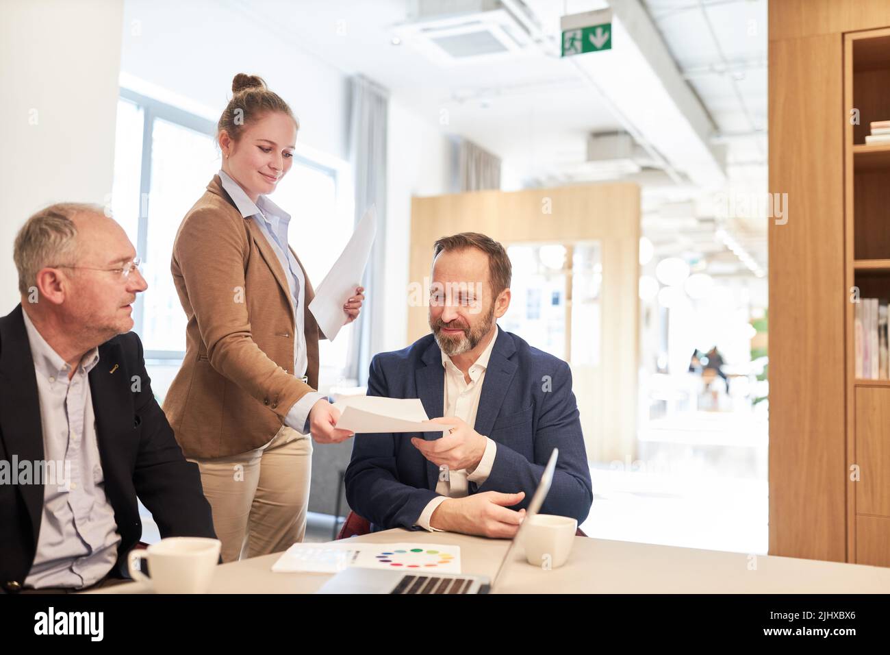 Handing over documents hi-res stock photography and images - Alamy