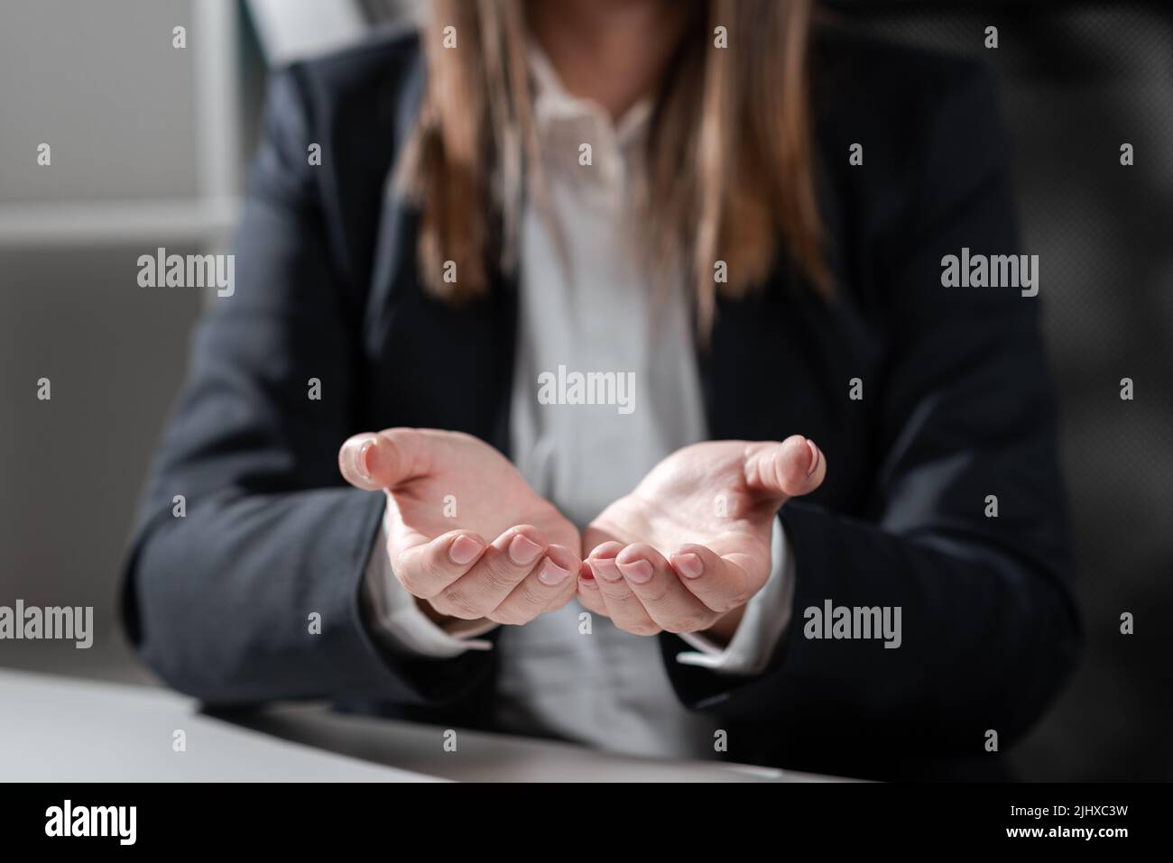 Businesswoman Holding Important Message On Hands. Woman In Suit Showing ...