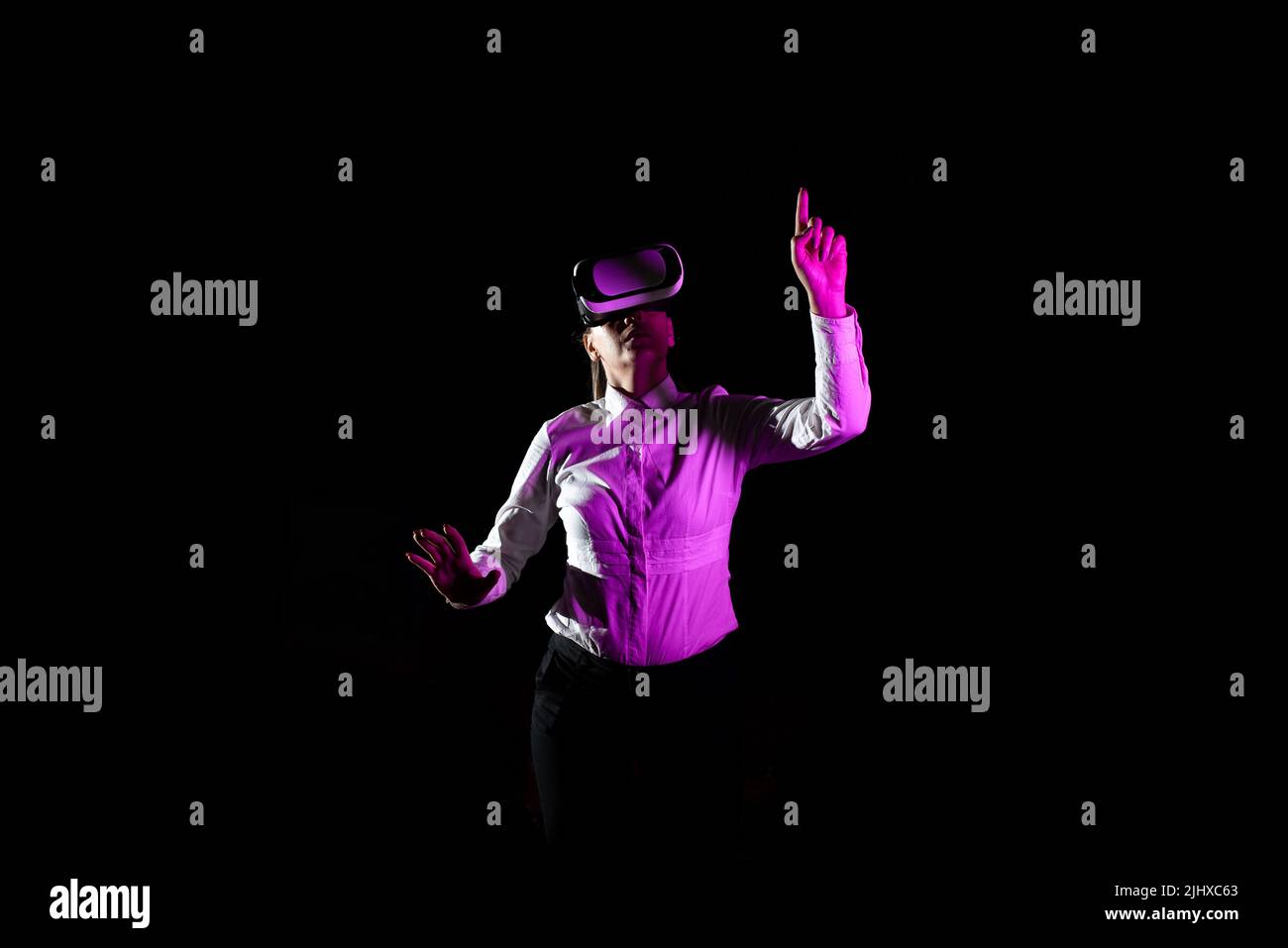 Female Manager Wearing Virtual Reality Goggles Gesturing While Taking ...