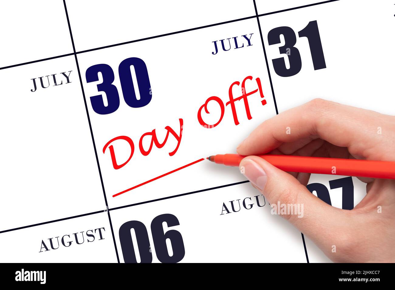 30th day of July. Hand writing text DAY OFF and drawing a line on ...