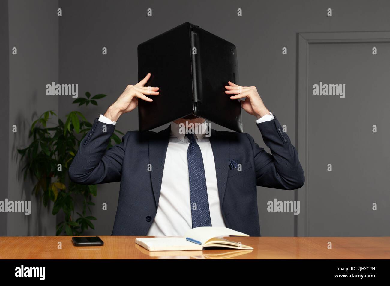 Hiding under desk hi-res stock photography and images - Alamy