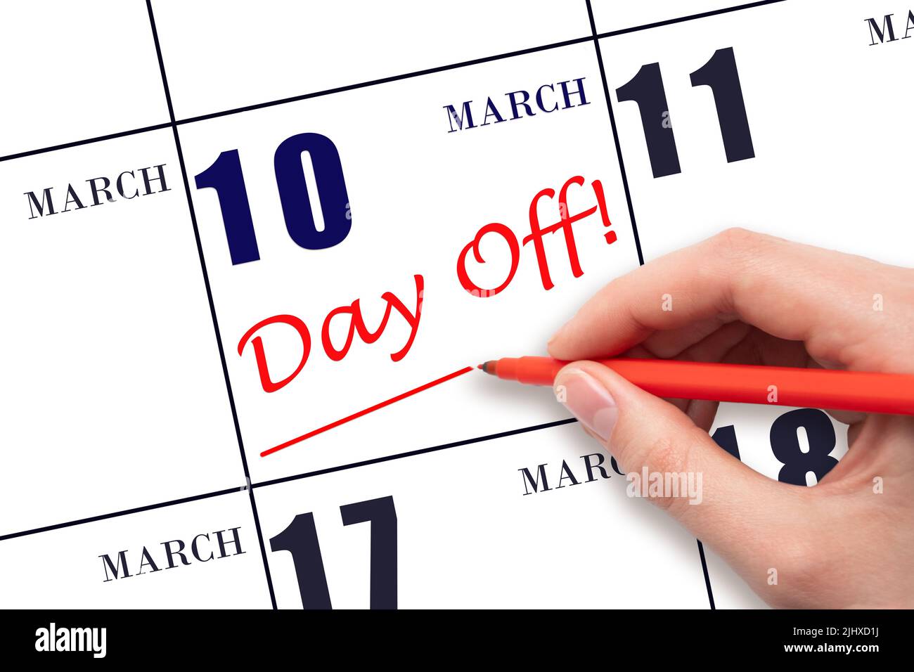 10th day of March. Hand writing text DAY OFF and drawing a line on ...