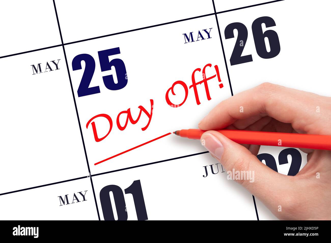 25th day of May. Hand writing text DAY OFF and drawing a line on ...
