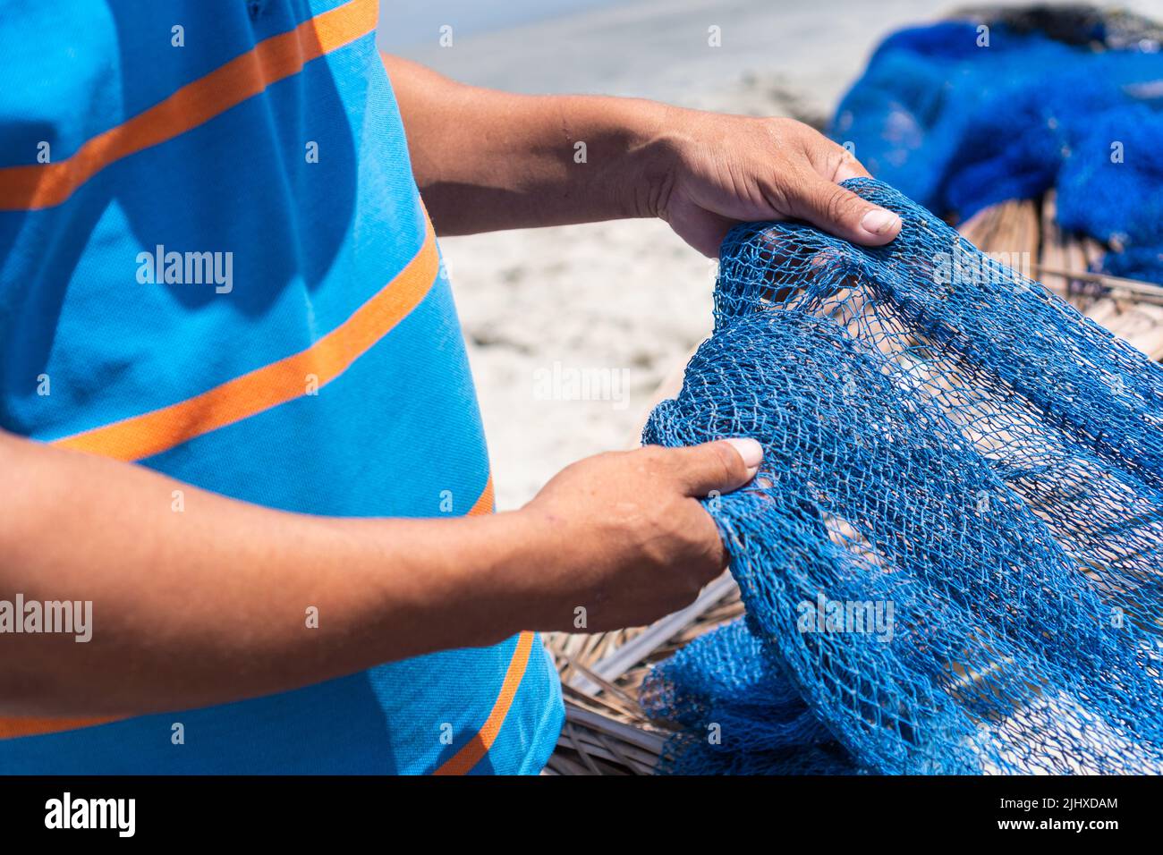 Fishermans hands hold fishing rod hi-res stock photography and images ...