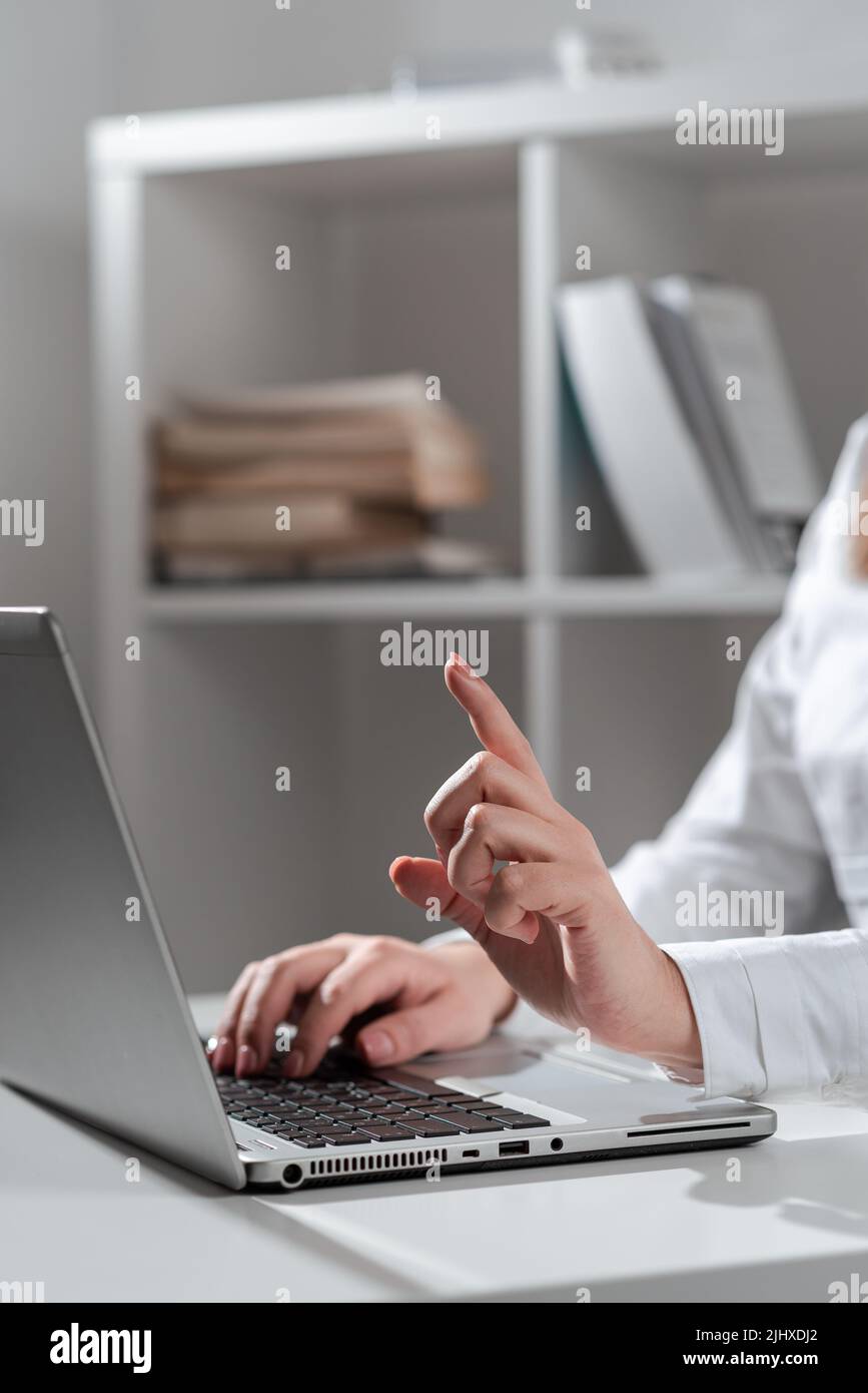 Businesswoman Typing Recent Updates On Lap Top Keyboard On Desk And ...