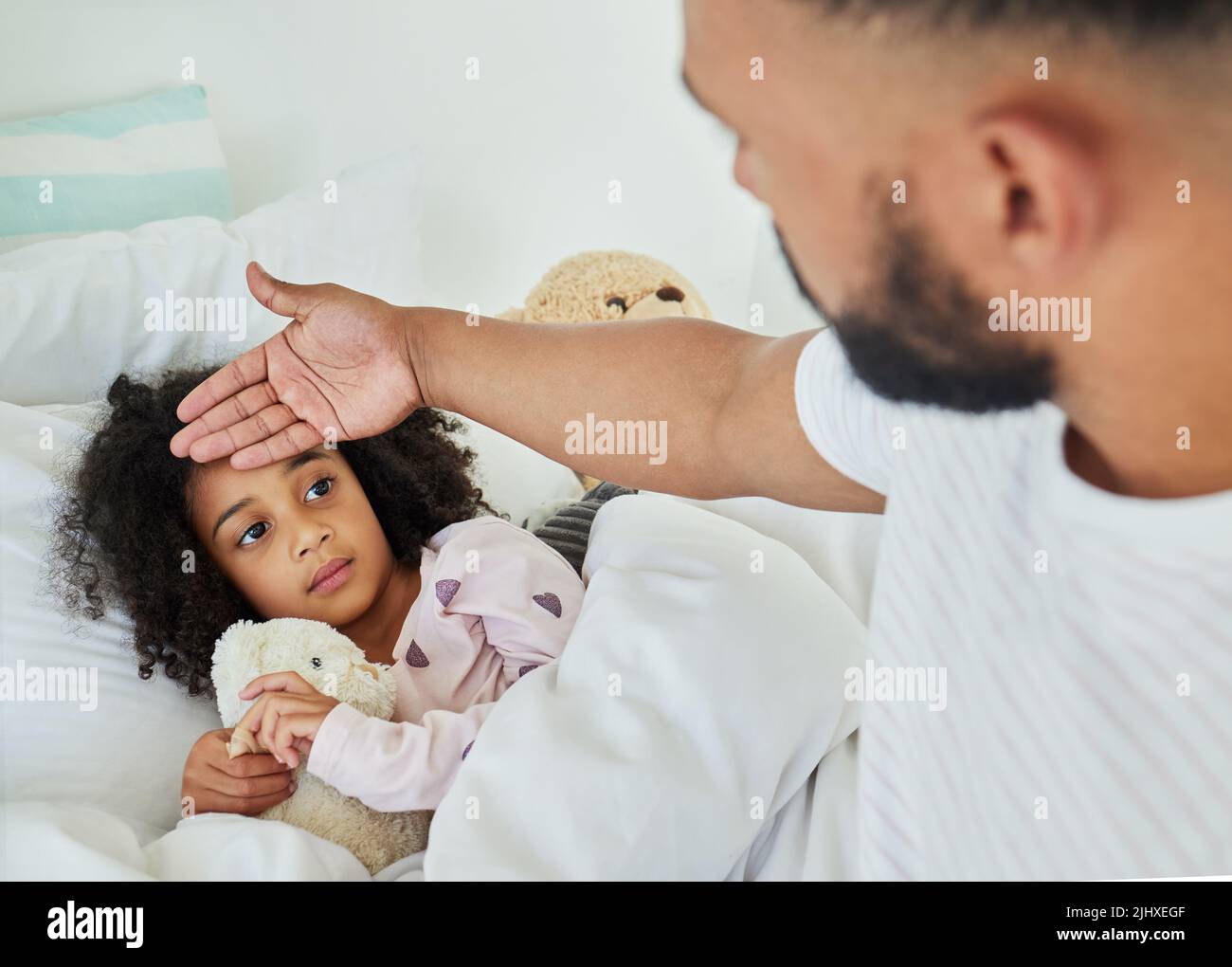 Its okay if youre not feeling well. a young father looking after his ...