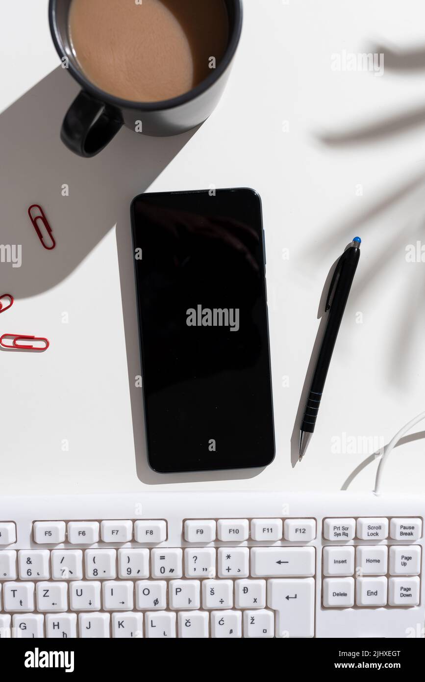 Phone Screen With Important Message On Desk With Keyboard, Pen, Clips ...