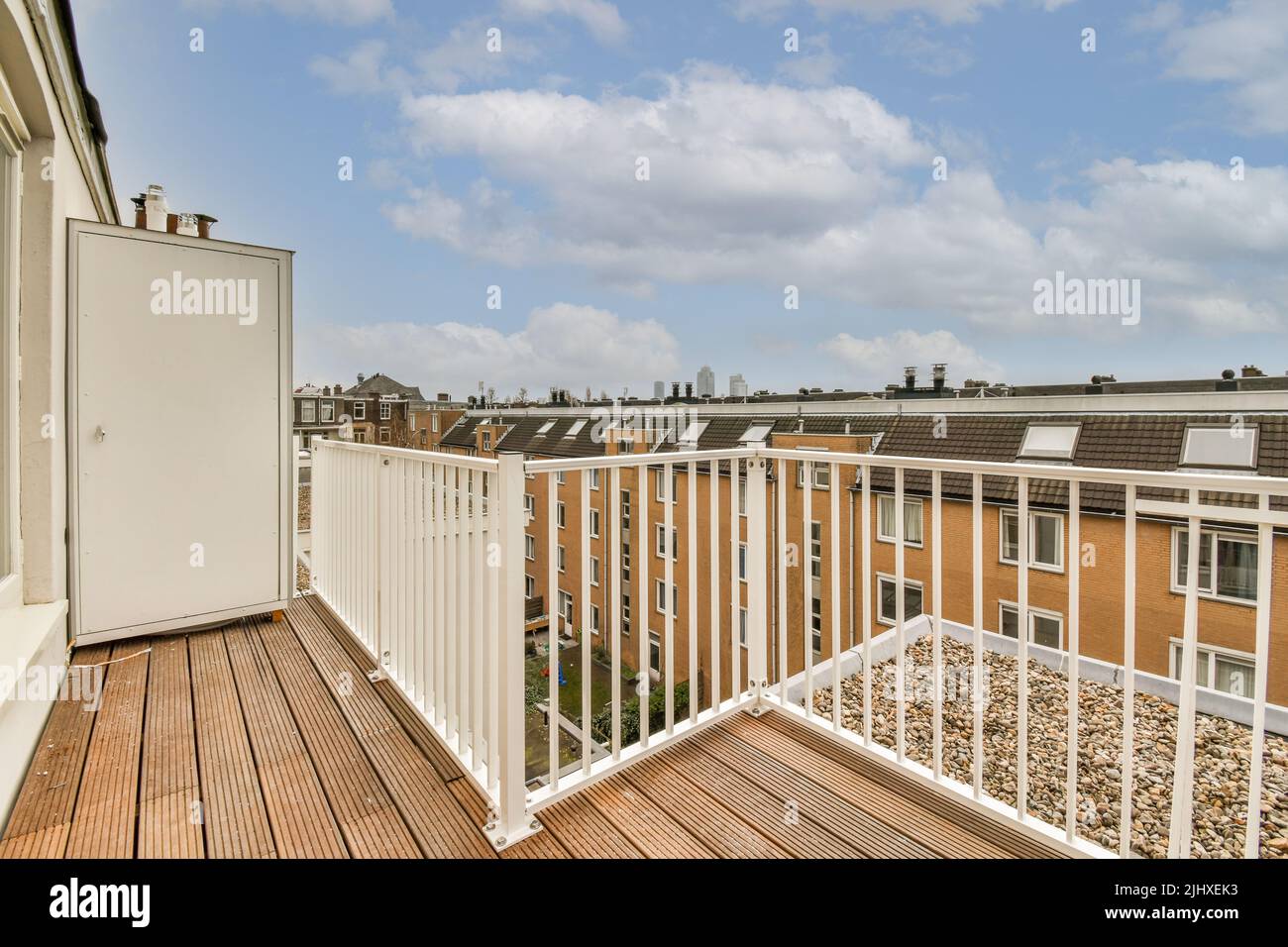 Narrow brick balcony with metal railings and door Stock Photo - Alamy