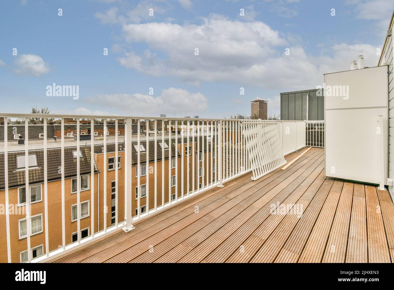 Narrow brick balcony with metal railings and door Stock Photo - Alamy